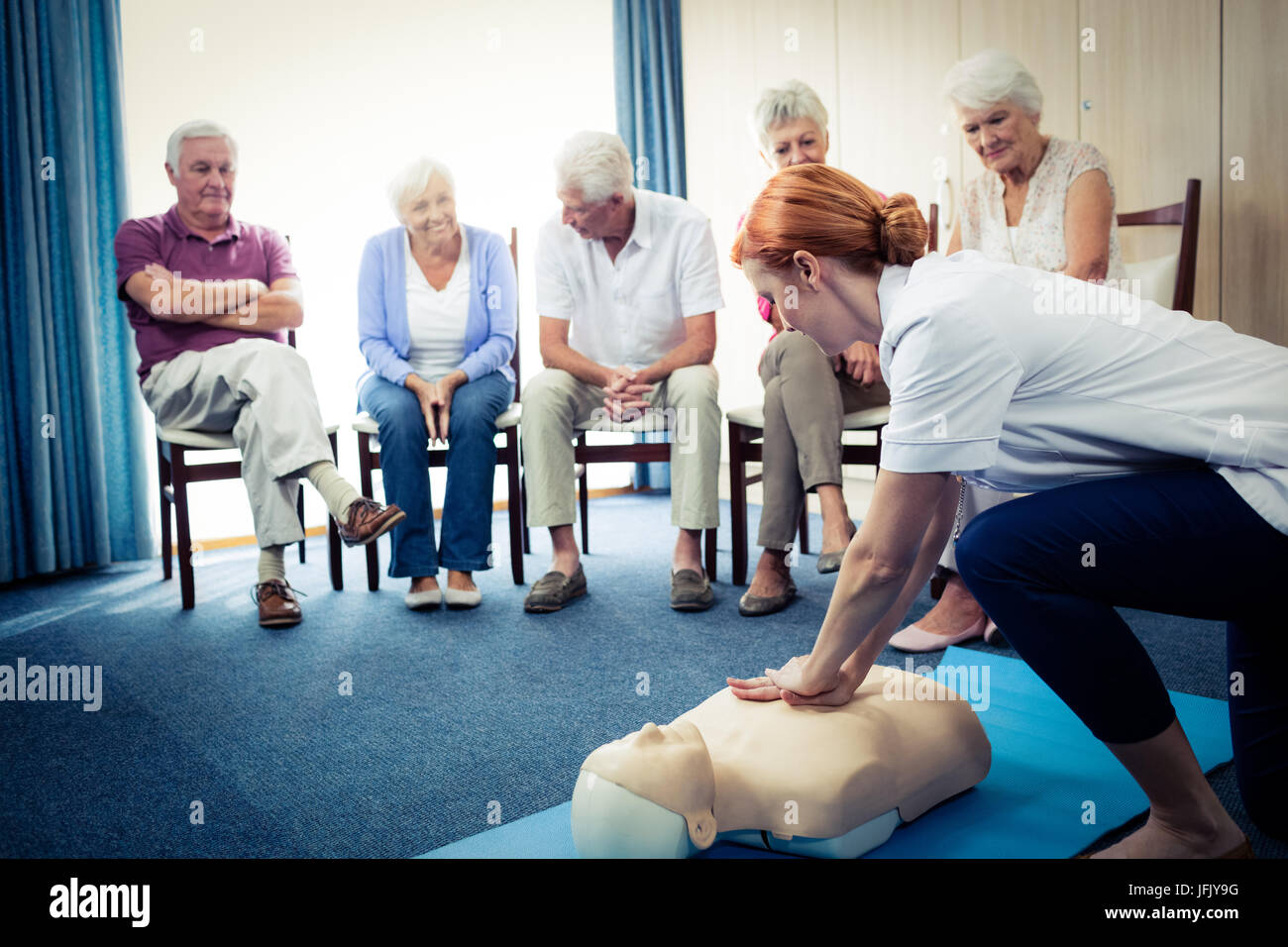 Nurse teaching first aid to a group of seniors Stock Photo - Alamy
