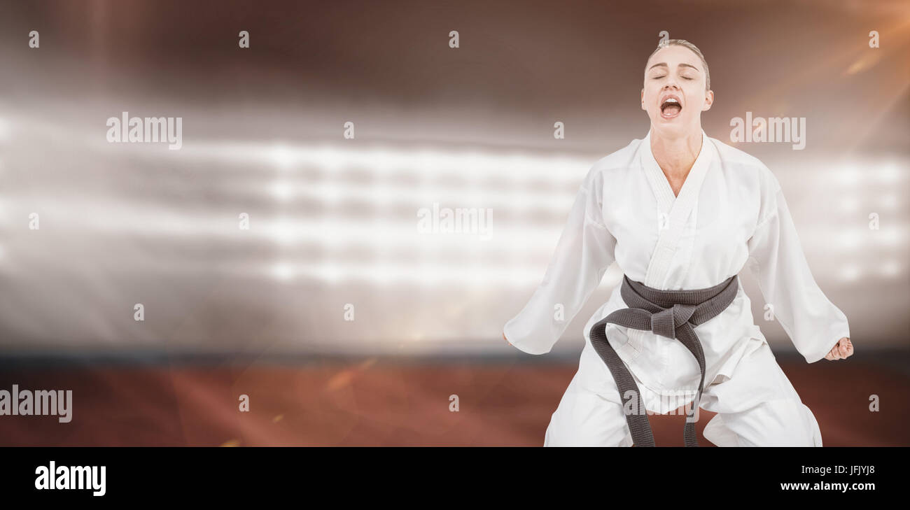 Composite image of female athlete practicing judo Stock Photo - Alamy