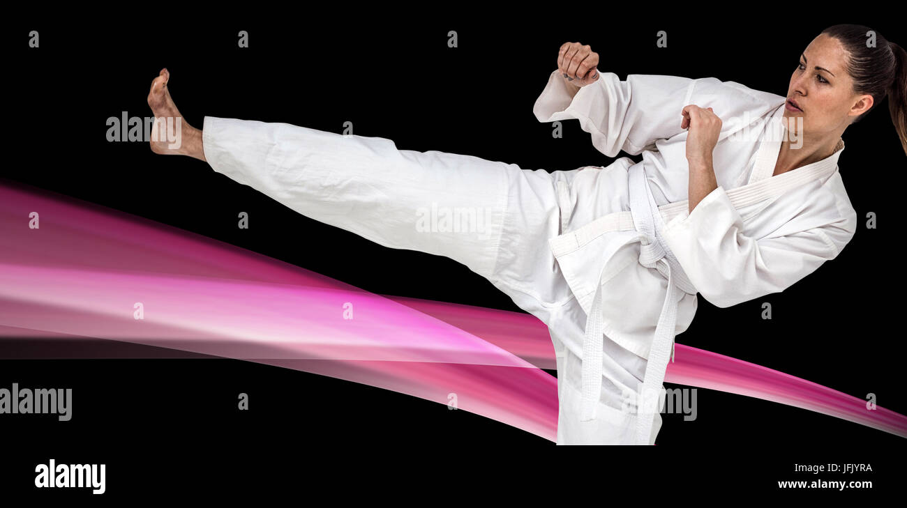 Composite image of fighter performing karate stance Stock Photo - Alamy