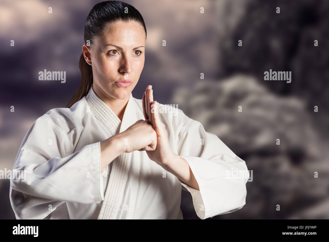 Composite image of female fighter performing hand salute Stock Photo ...