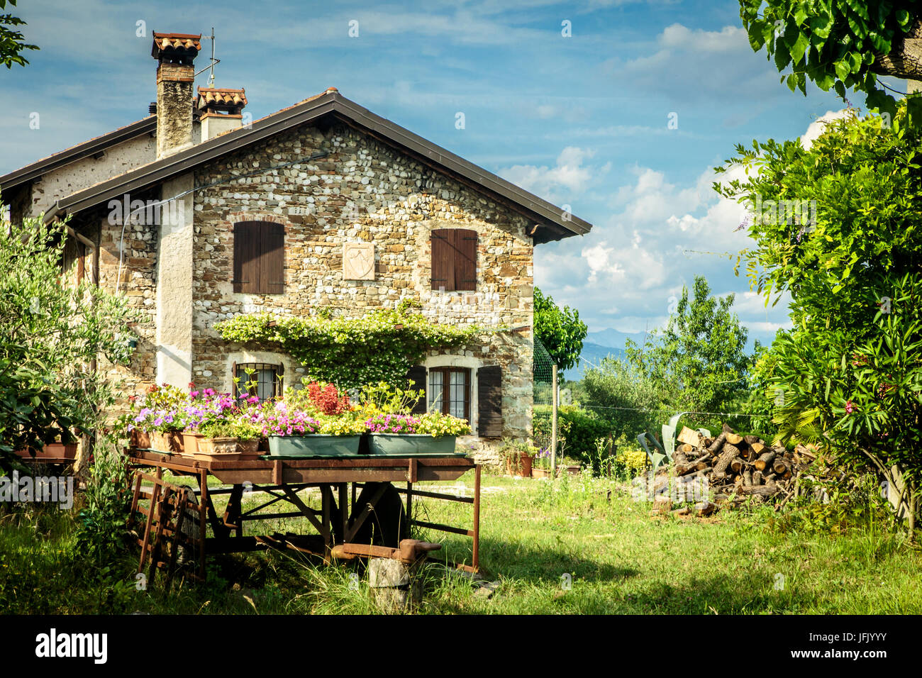An old farm in the italian countryside with flowers in its garden Stock ...