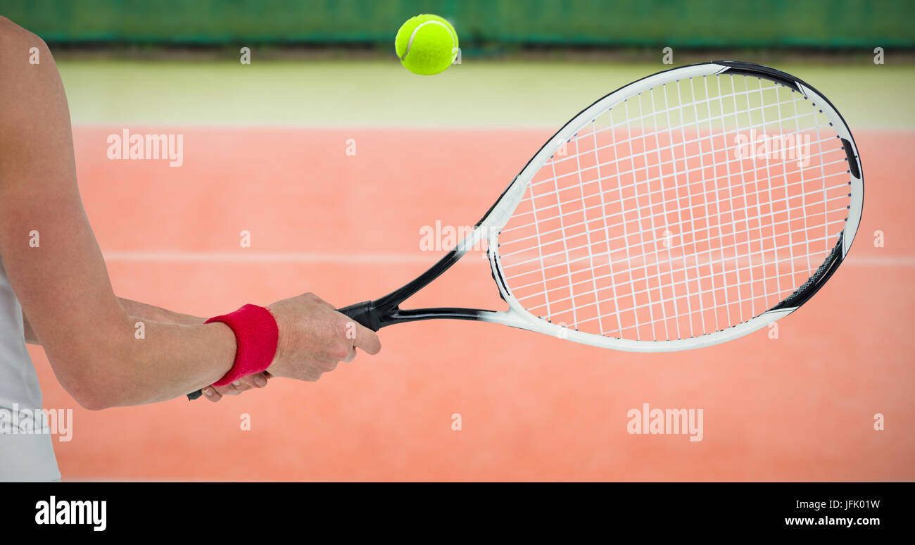 Composite image of athlete playing tennis with a racket Stock Photo - Alamy