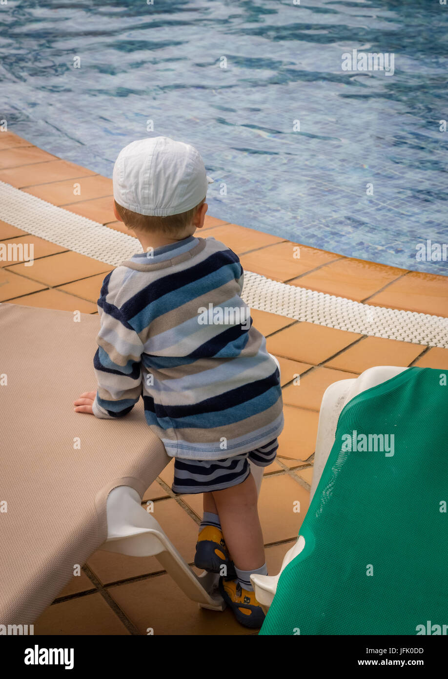 Boy standing next to water hi-res stock photography and images - Alamy