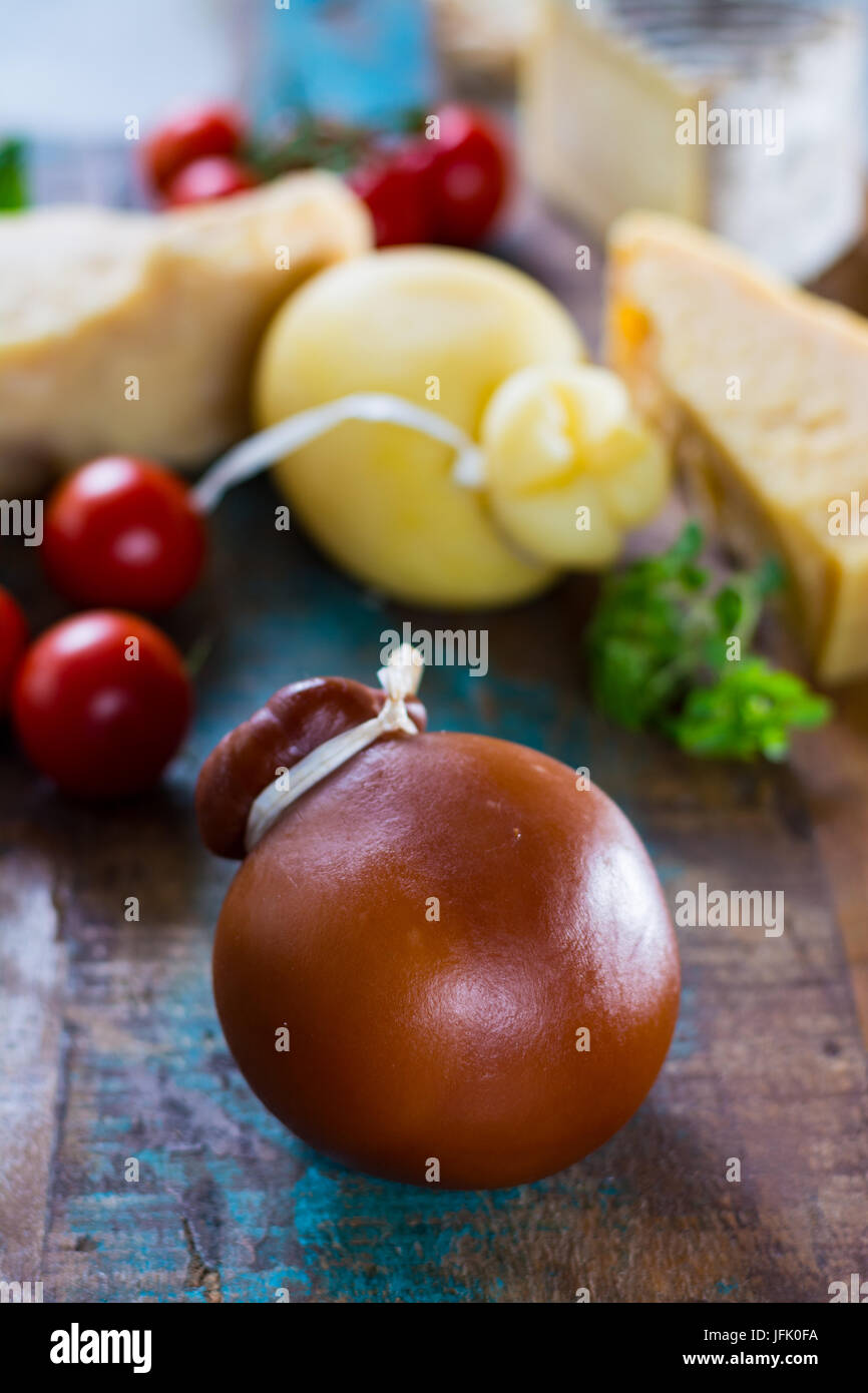 Traditional Italian hard cheese Provolone of Caciocavallo smoked and ...