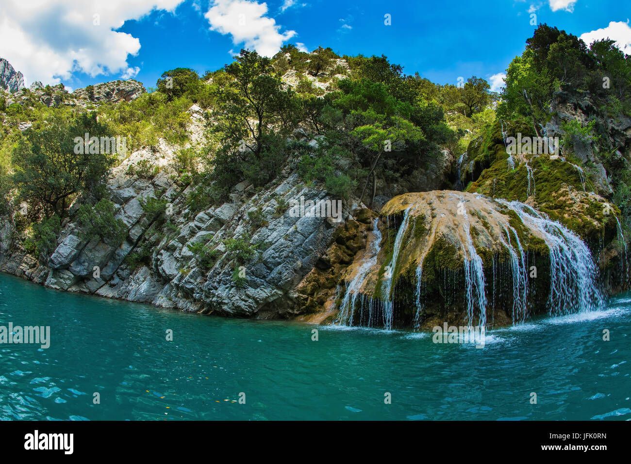 Scenic round waterfall in the side wall of canyon Stock Photo - Alamy