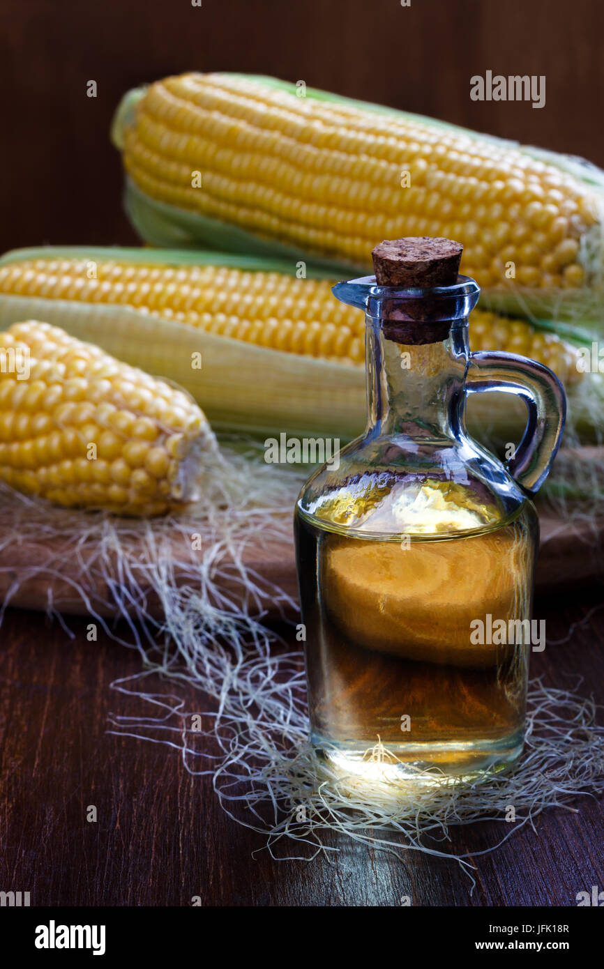 Fresh corn with bottle of oil Stock Photo - Alamy