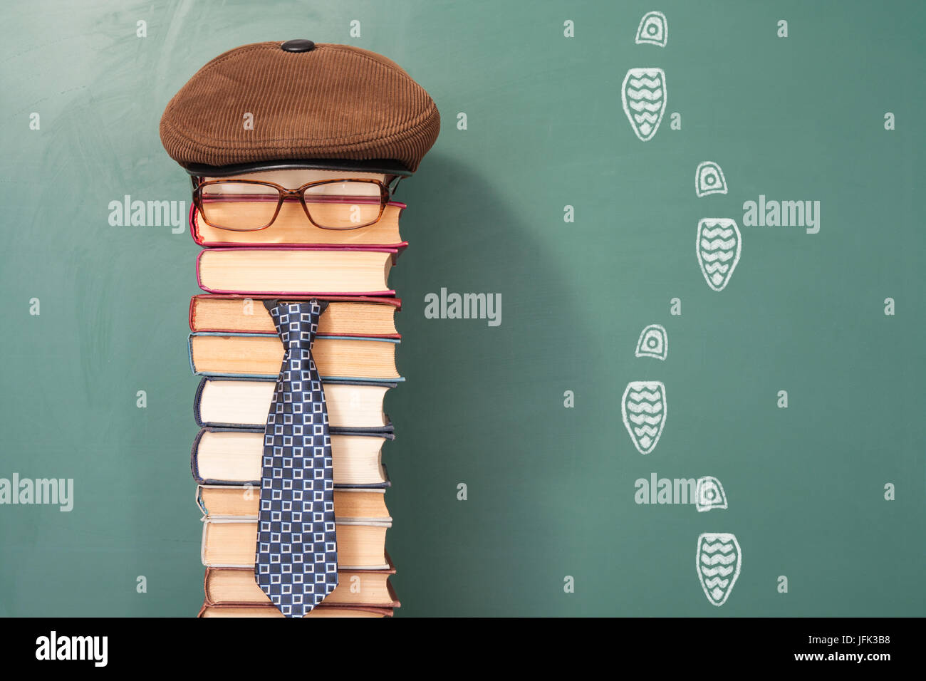 Funny education concept with the teacher and the traces on the board ...