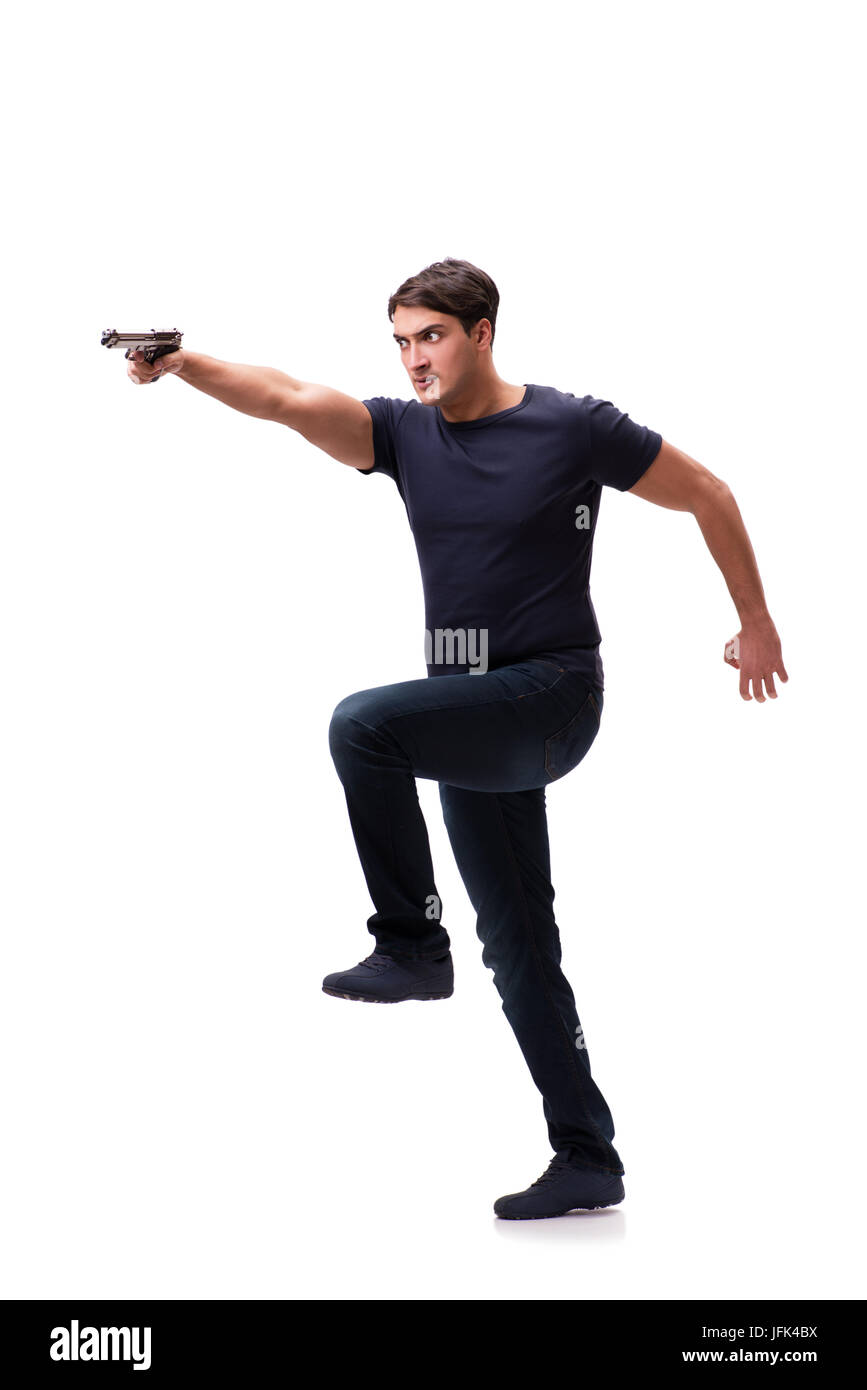 Aggressive young man with gun isolated on white Stock Photo - Alamy