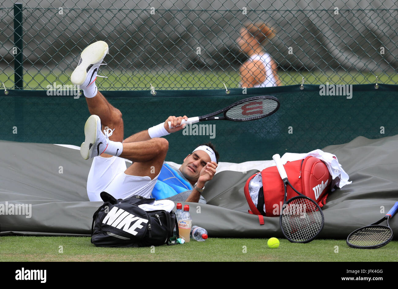 Roger Federer takes a break during a preview day at the The All England ...