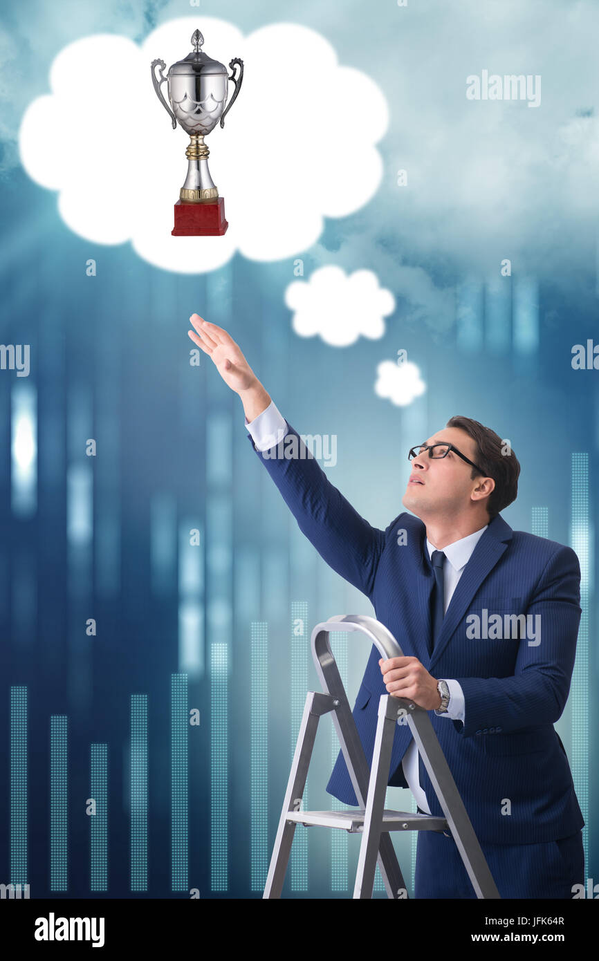 Businessman climbing towards his business goal Stock Photo - Alamy
