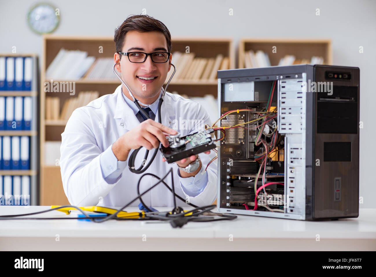 Proffesional repairman repairing broken hard drive Stock Photo - Alamy