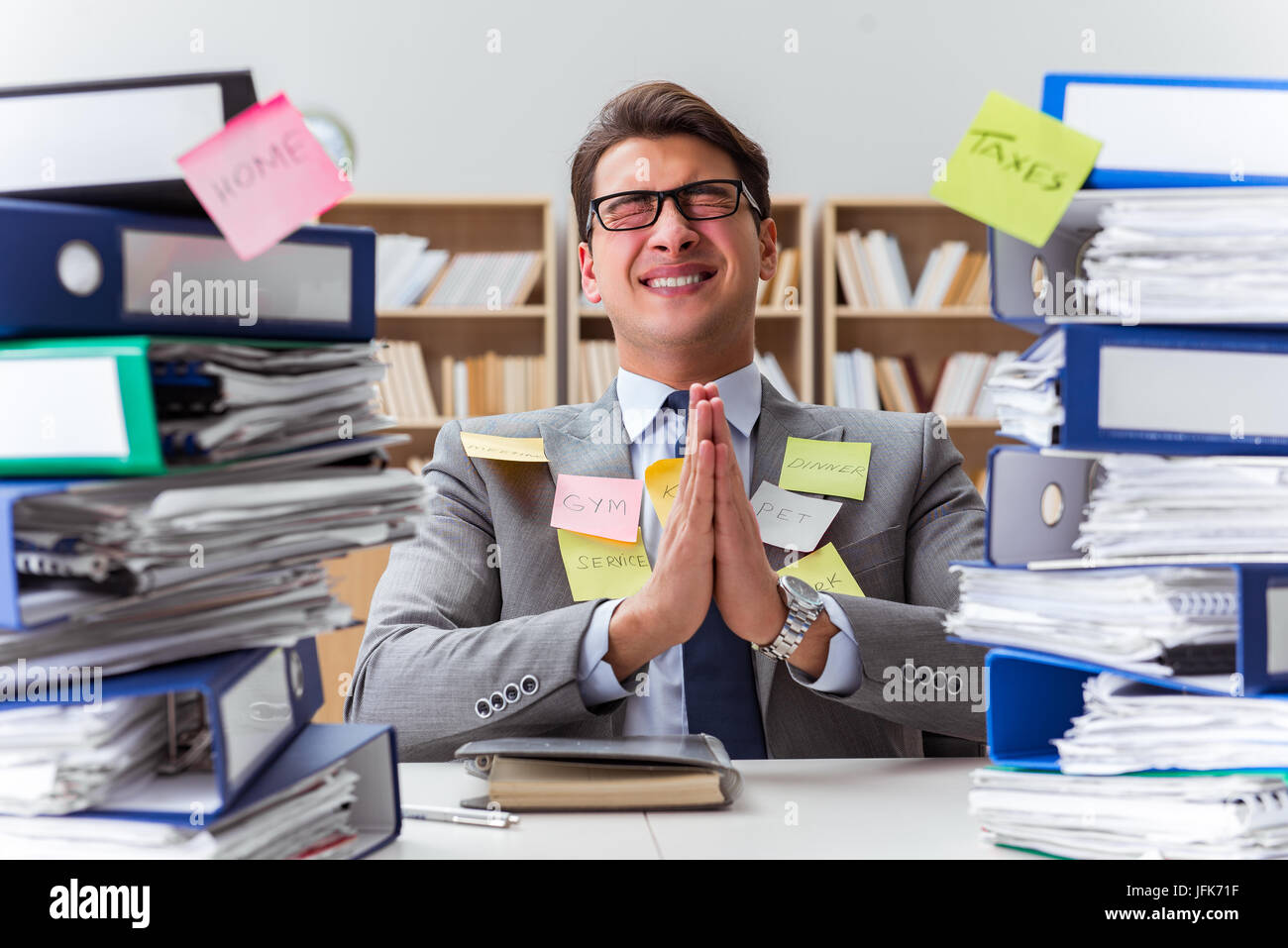 Businessman struggling with multiple priorities Stock Photo - Alamy