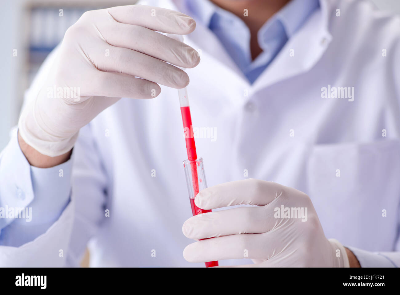 Blood testing in the lab with young scientist Stock Photo - Alamy