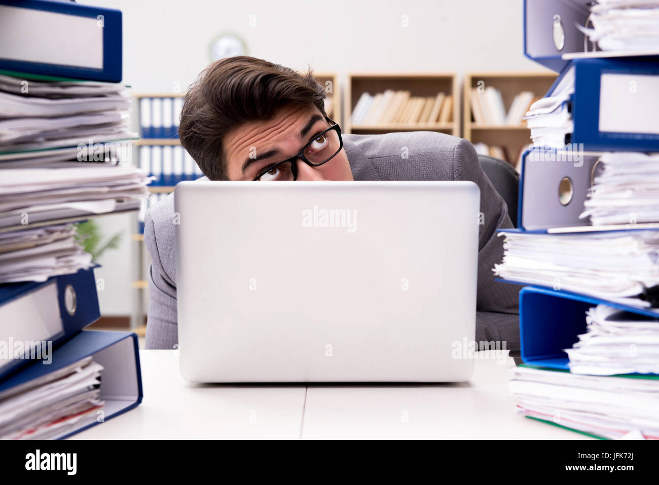 Busy businessman under stress due to excessive work Stock Photo - Alamy