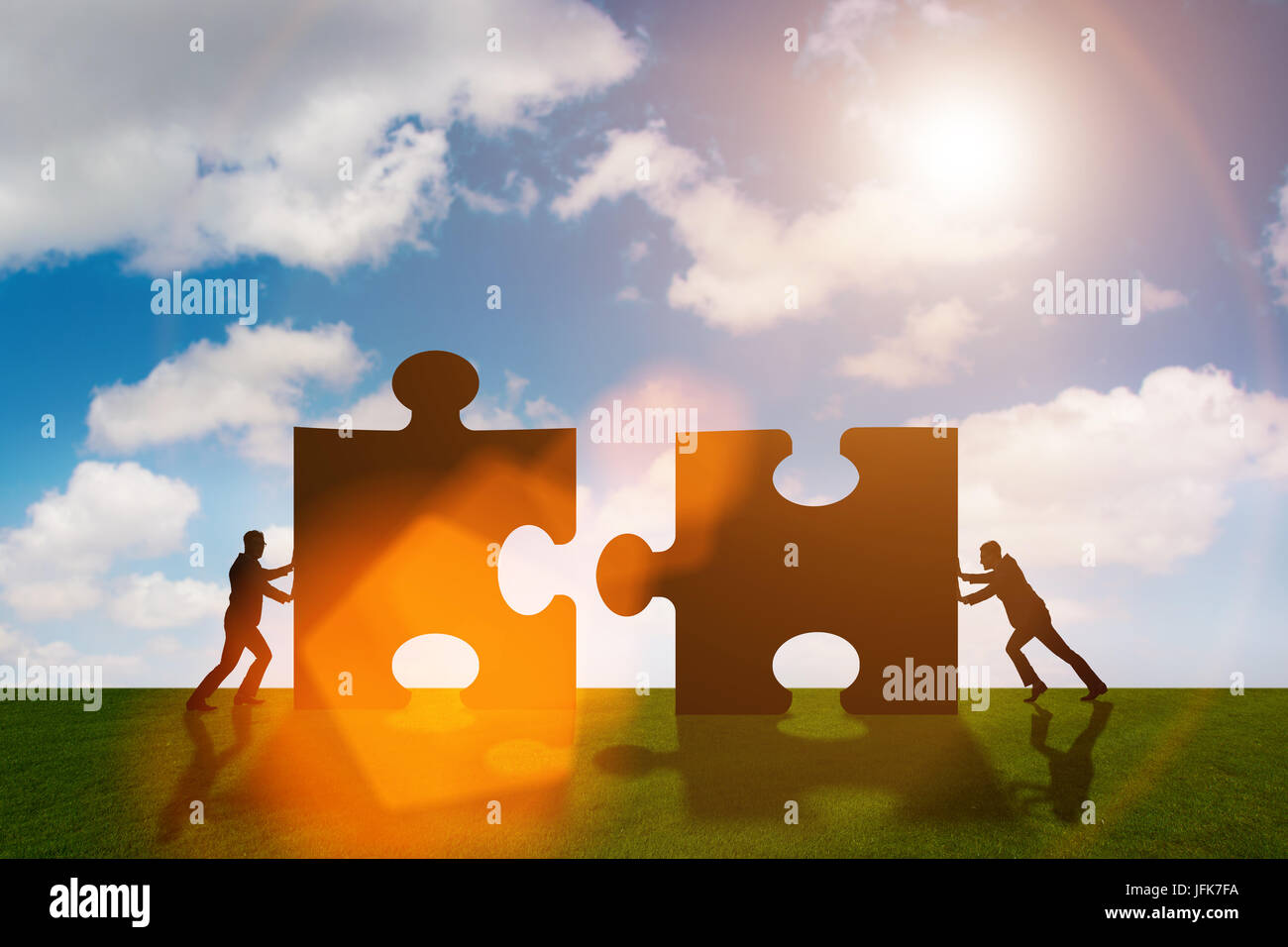 Business metaphor of teamwork with jigsaw puzzle Stock Photo - Alamy