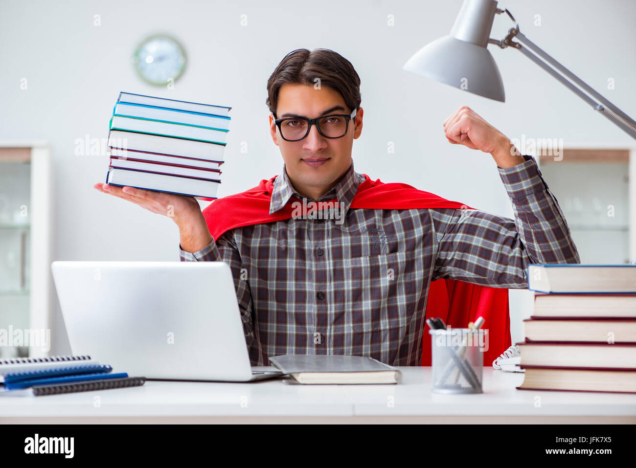 Super hero student with books studying for exams Stock Photo - Alamy