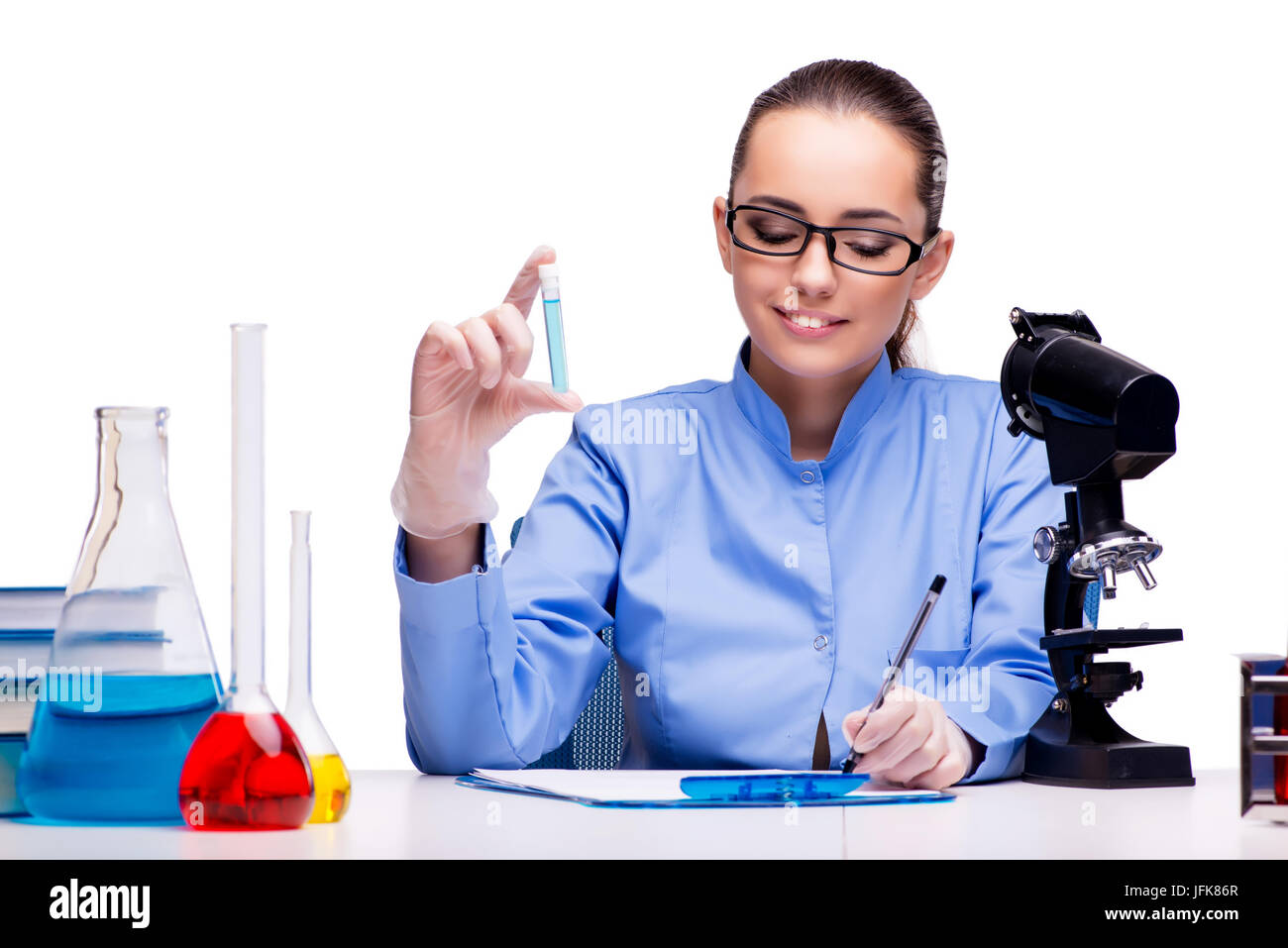 Lab chemist working with microscope and tubes Stock Photo - Alamy