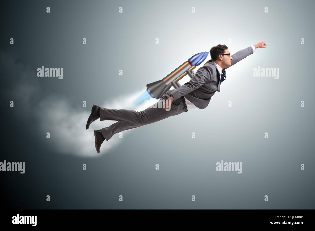 Man flying with the rocket in business concept Stock Photo - Alamy