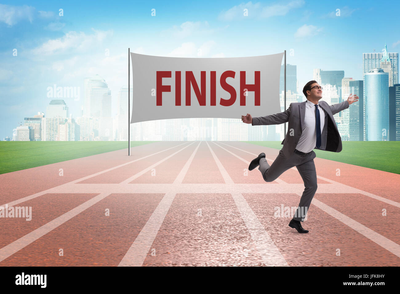 Businessman on the finishing line in competition concept Stock Photo ...