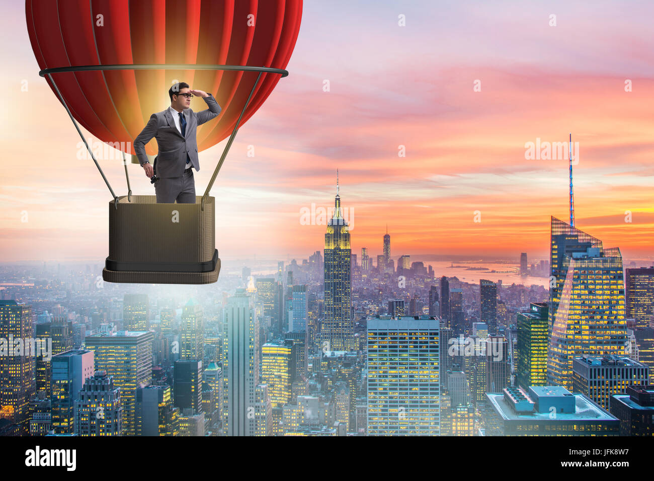 Businessman flying on balloon in challenge concept Stock Photo - Alamy
