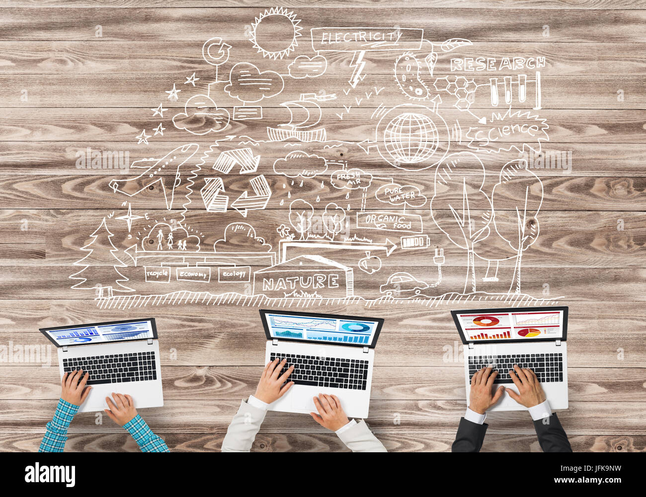 Group of three people with devices in hands working together as symbol ...