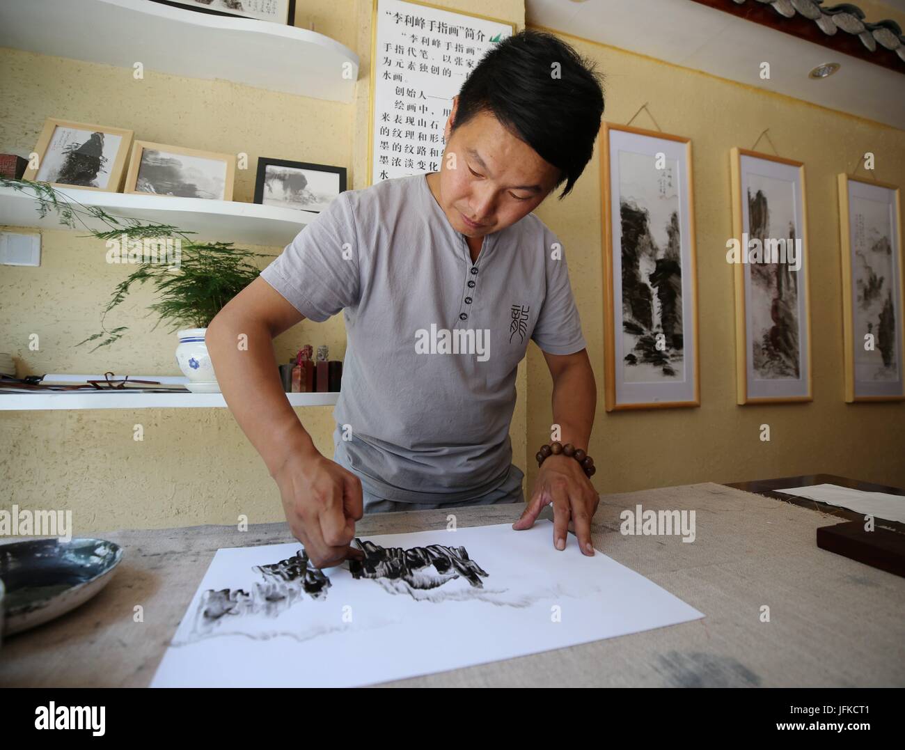 Zhangjiajie, China's Hunan Province. 1st July, 2017. Li Lifeng paints ...