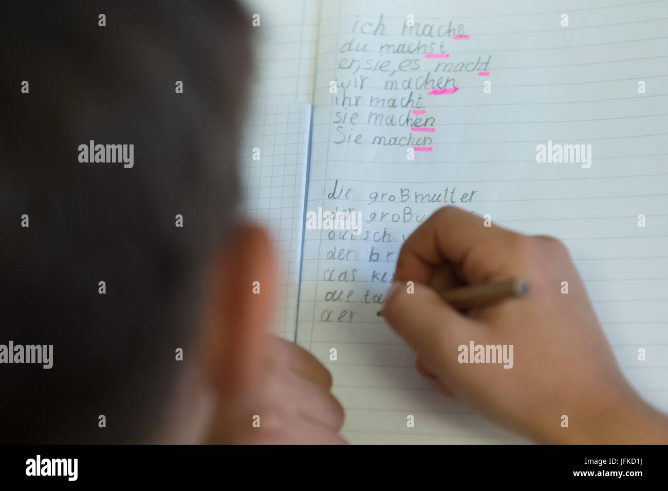 Chemnitz, Germany. 29th June, 2017. A boy takes notes during German ...