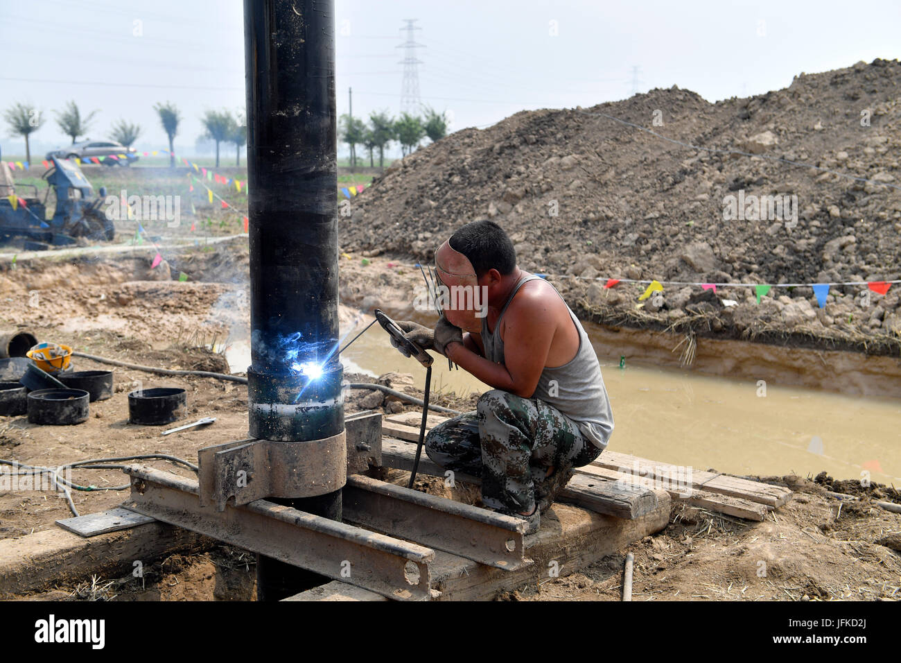 Anxin, China's Hebei Province. 1st July, 2017. An expert welds a pipe ...