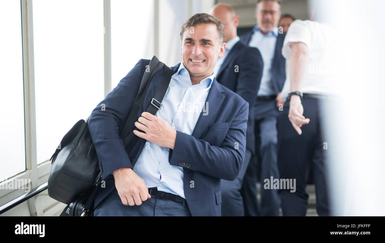 dpatop - Head coach Stefan Kuntz departs the plane carrying the Germany ...