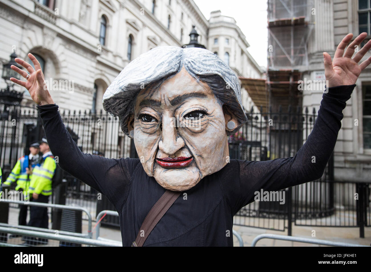 London, UK. 1st July, 2017. A protester wearing a Theresa May mask ...