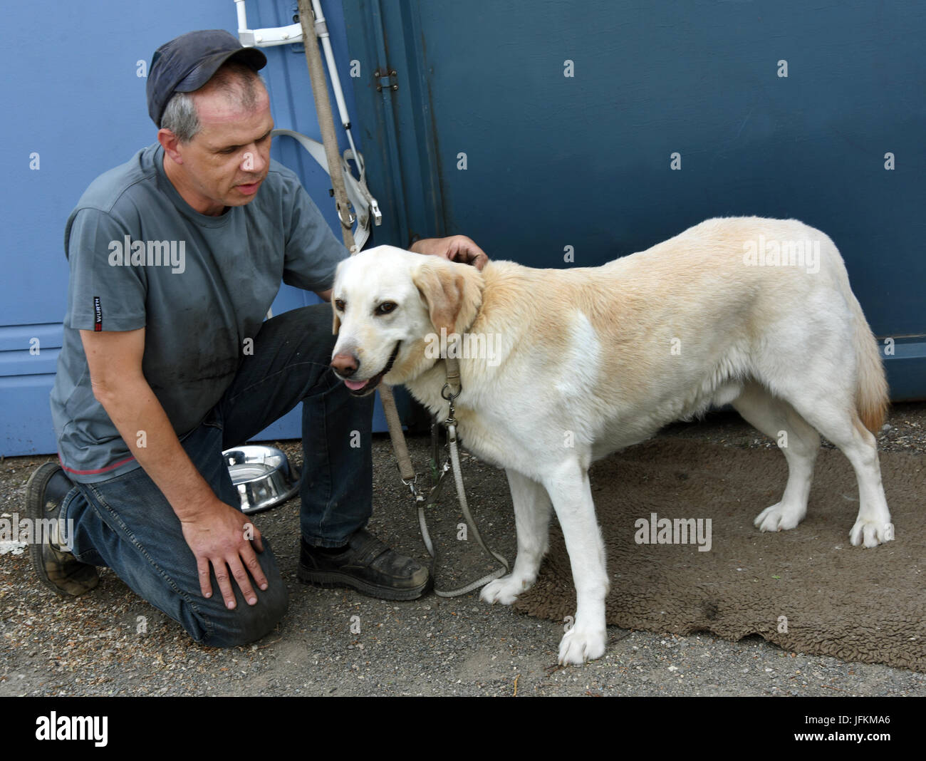 Picture of the blind man, Bernd Rothig, speaking with his companion dog ...