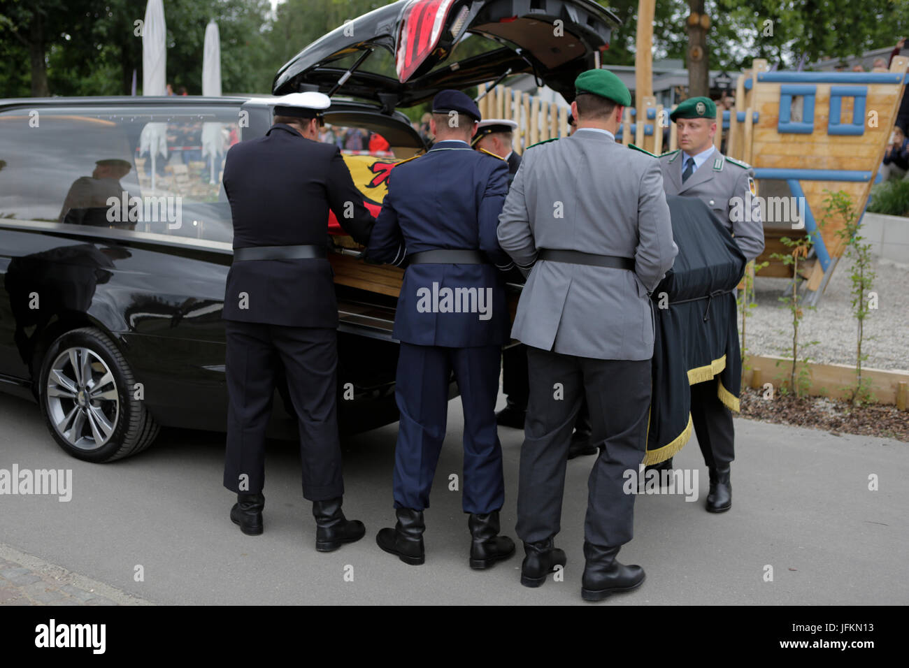 The coffin of Helmut Kohl is loaded into the hearse,The coffin of ...
