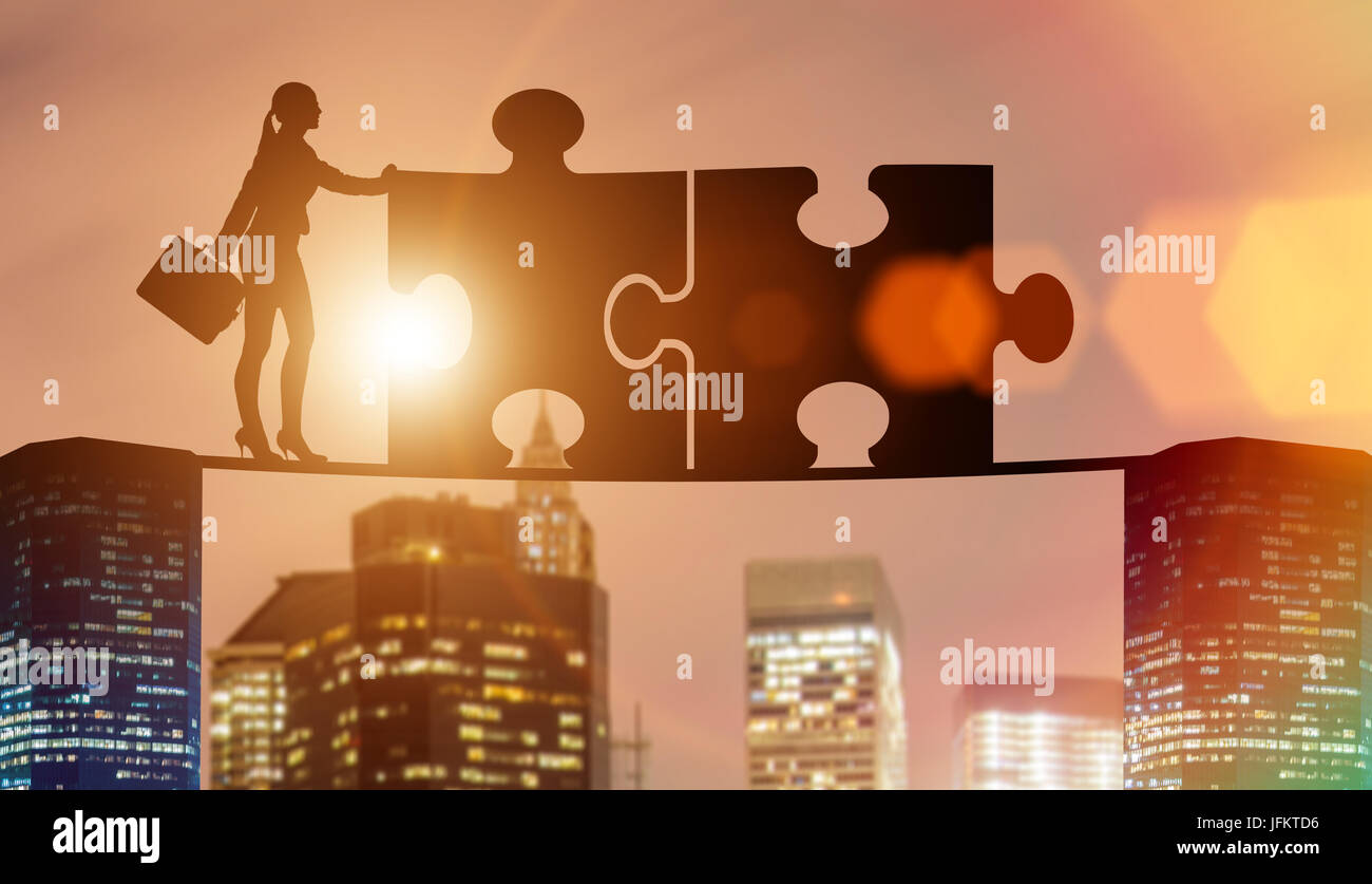 Business concept of teamwork with jigsaw puzzle Stock Photo - Alamy