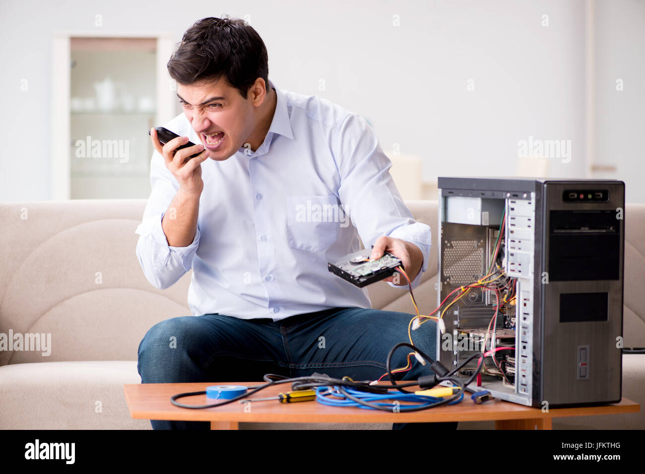 Trying to repair computer hi-res stock photography and images - Alamy