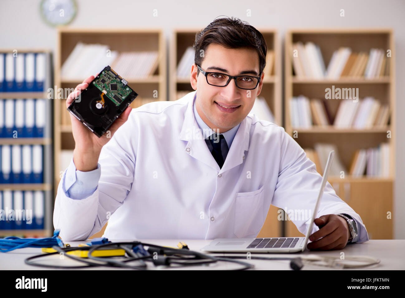 Proffesional repairman repairing broken hard drive Stock Photo - Alamy
