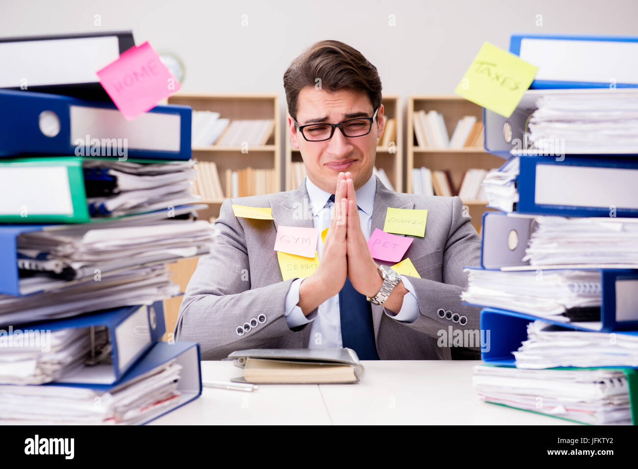 Businessman struggling with multiple priorities Stock Photo - Alamy