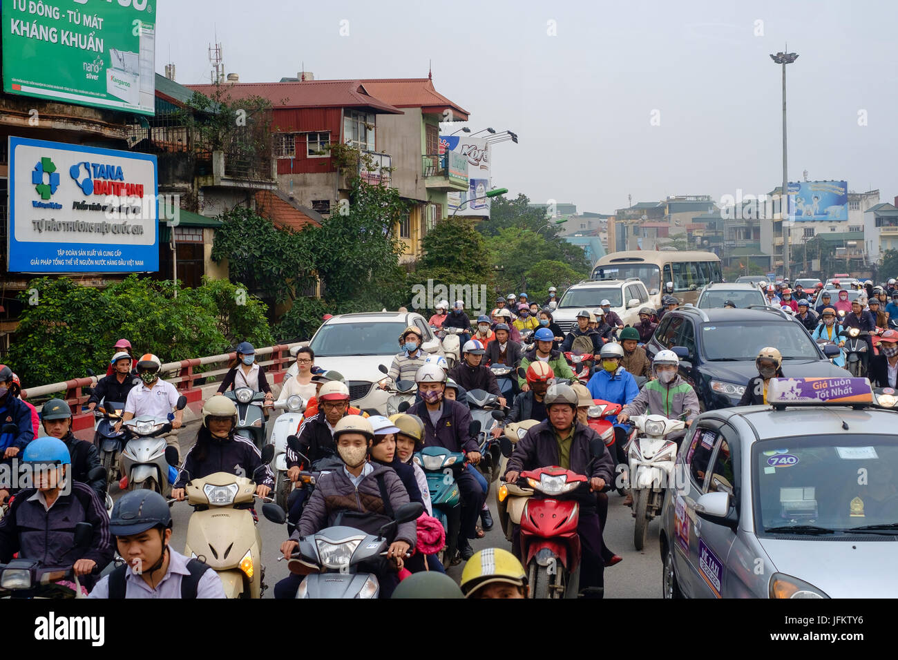 Motorbikes on a busy road in Hanoi, Vietnam Stock Photo - Alamy