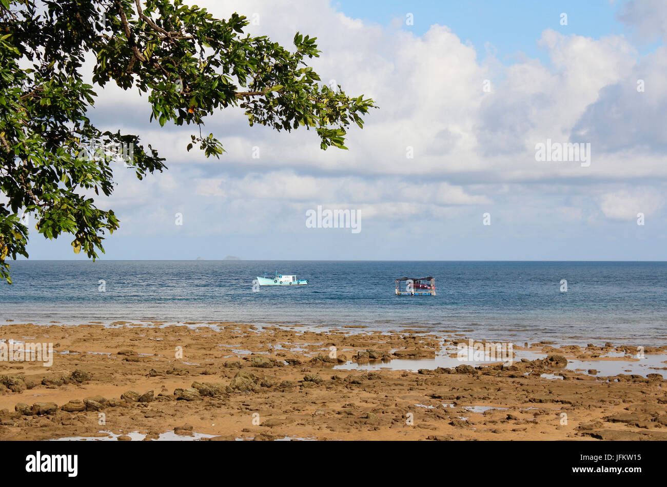 Seaside view of low tide with the boats at Tioman Island Stock Photo ...