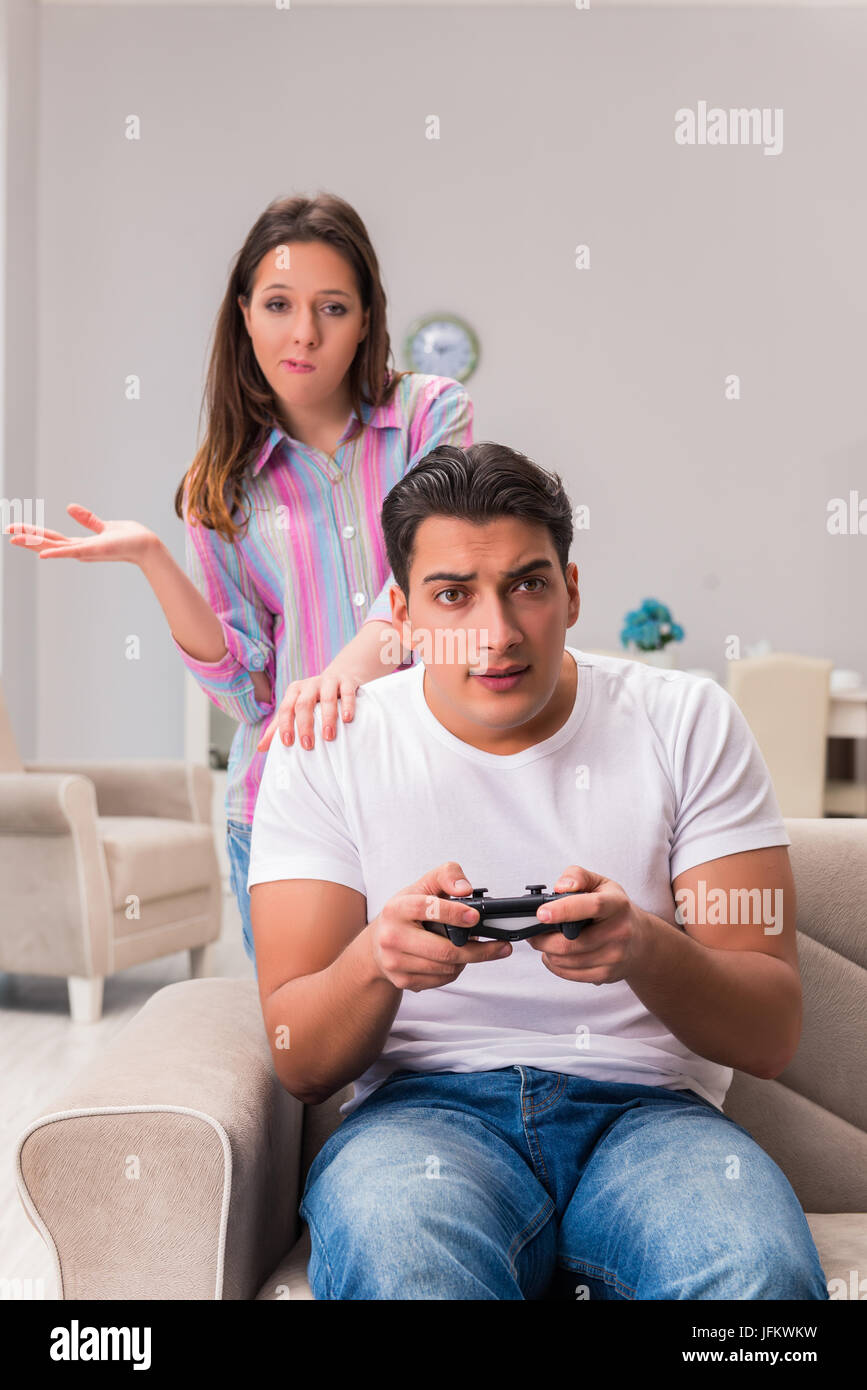 Young family suffering from computer games addiction Stock Photo - Alamy