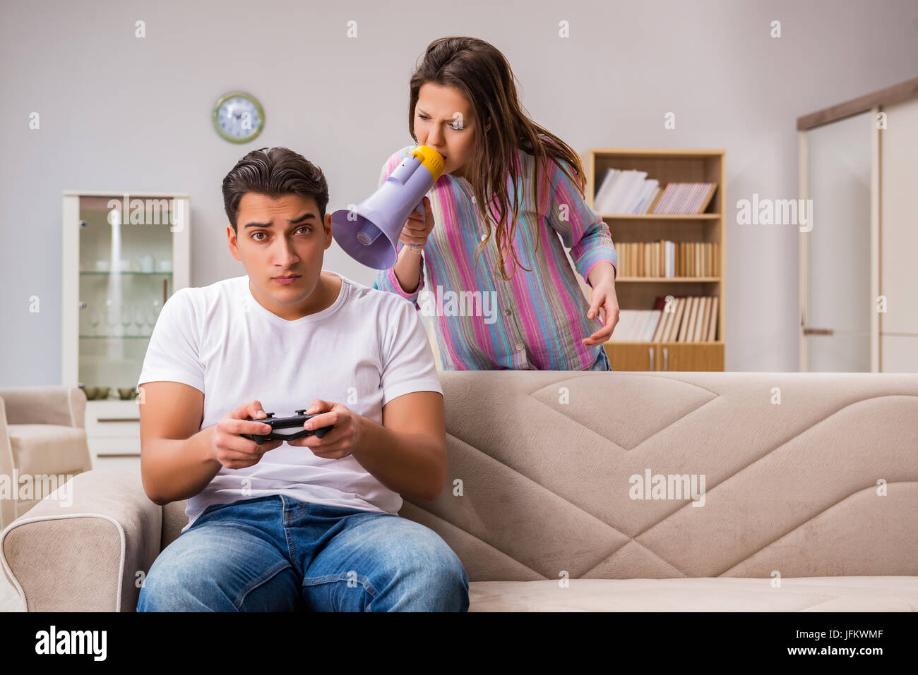 Young family suffering from computer games addiction Stock Photo - Alamy