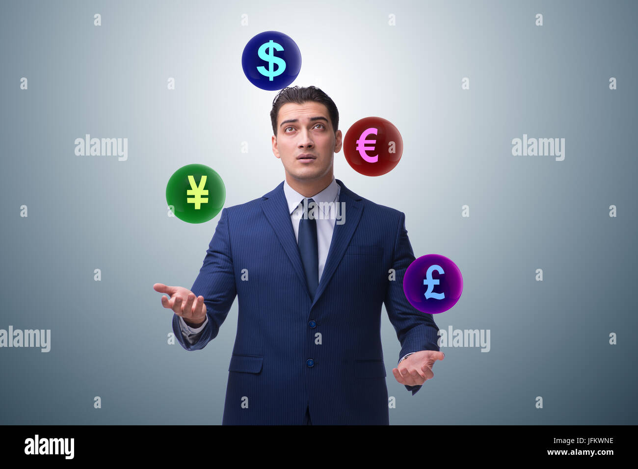 Businessman juggling between various currencies Stock Photo - Alamy