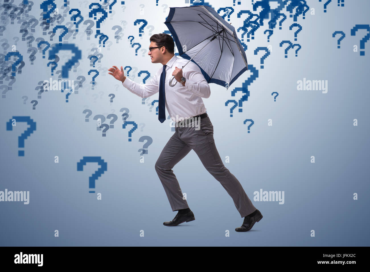 Uncertainty concept with businessman and question marks Stock Photo - Alamy