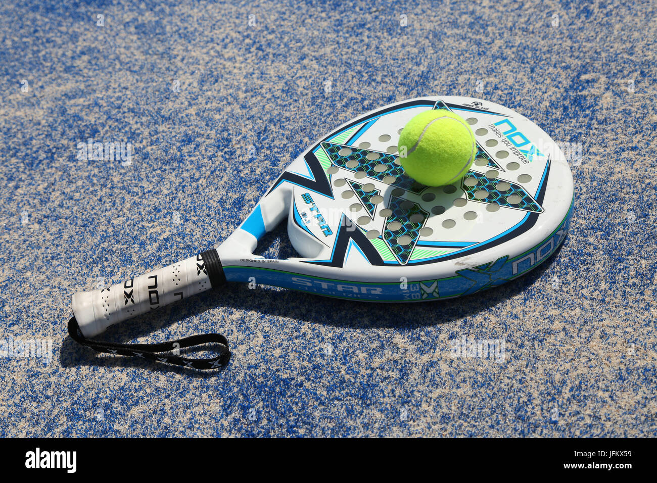 A padel racket and a ball on a padel field Stock Photo - Alamy