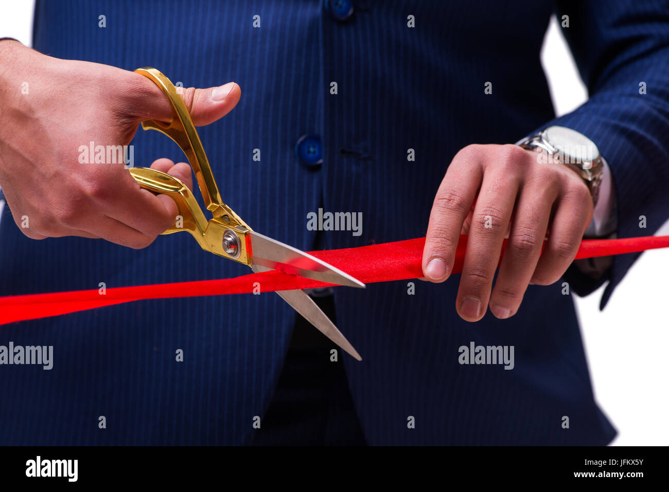 Businessman cutting red ribbon isolated on white Stock Photo - Alamy