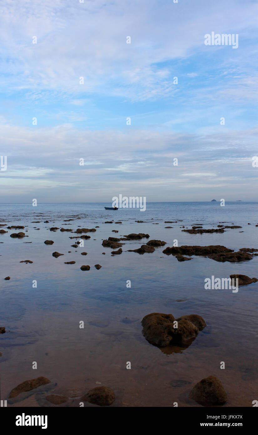 View of dawn at the seaside with a man on the boat, Tioman Island Stock ...