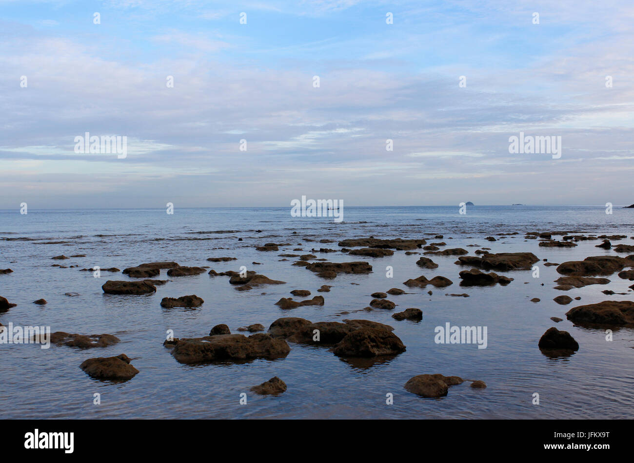 View of dawn at the seaside with a man on the boat, Tioman Island Stock ...