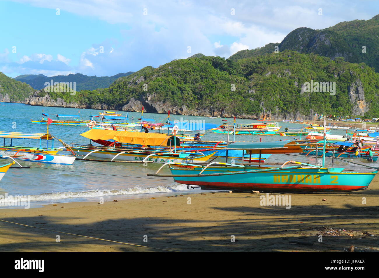 Blue boat in a beach Stock Photo - Alamy
