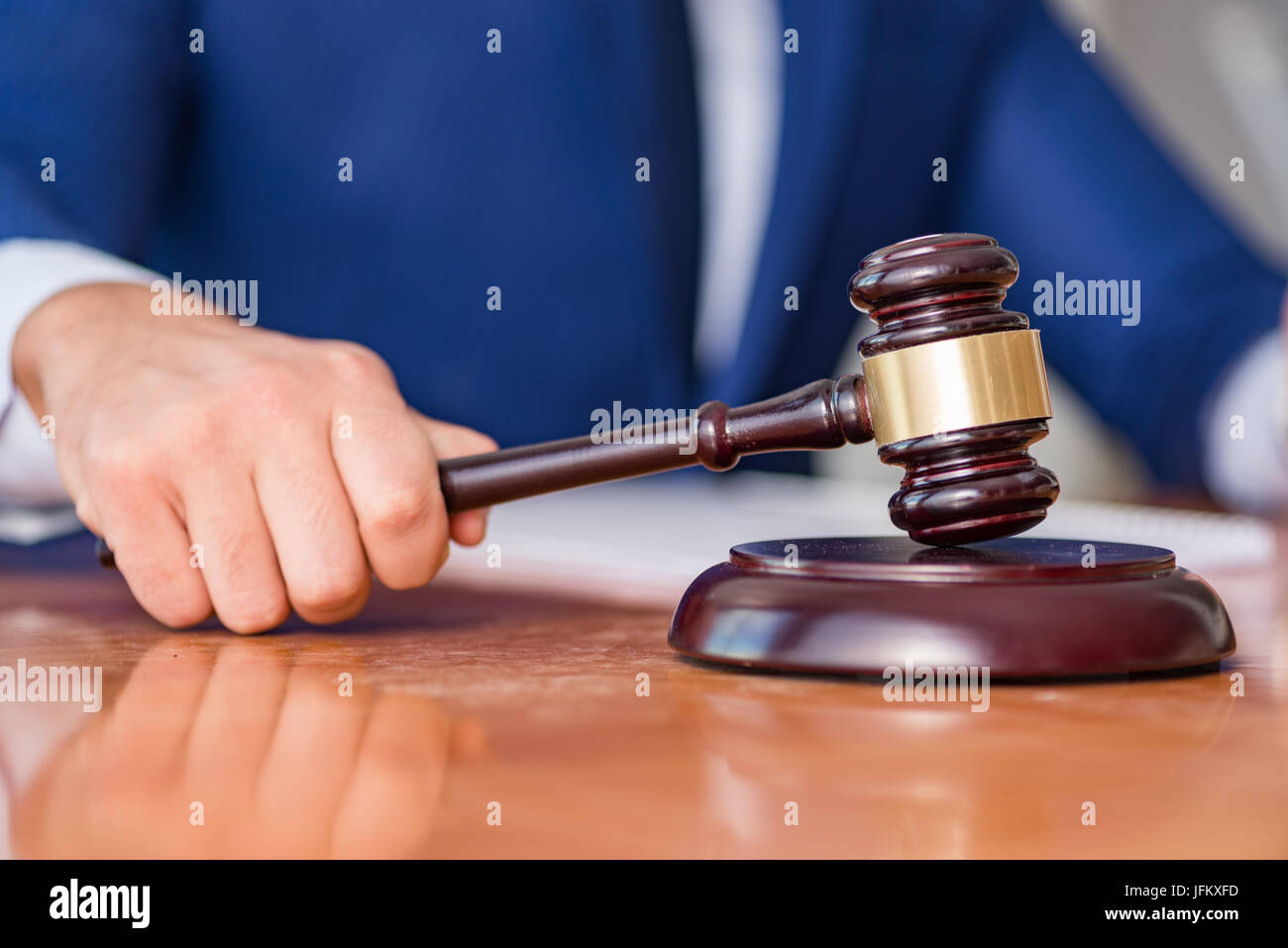 Handsome judge with gavel sitting in courtroom Stock Photo - Alamy