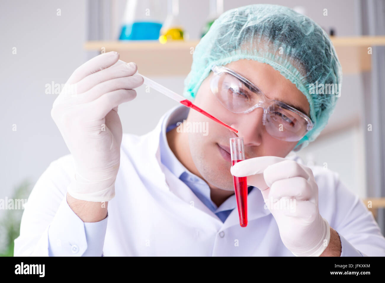 Blood testing in the lab with young scientist Stock Photo - Alamy