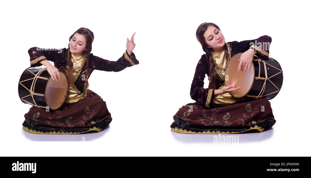 Young azeri woman playing traditional drum nagara Stock Photo - Alamy